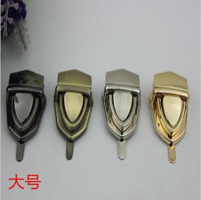 China Promotional bag metal fittings handbag locks modern light gold push lock for leather bags for sale