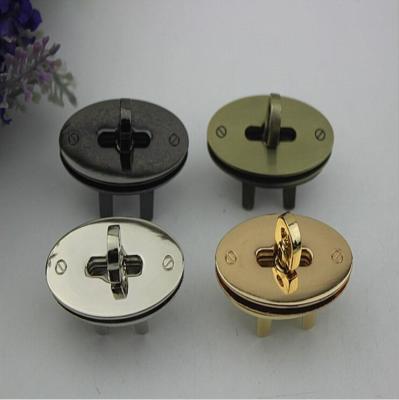China Fashion new style oval shape zinc alloy gunmetal color bag turn locks for sale