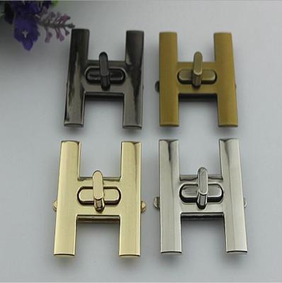 China Novelty design H letters zinc alloy metal gold handbag turn locks for sale