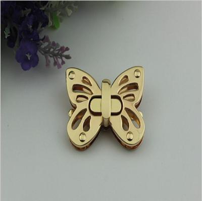 China Shiny gold metal zinc alloy butterfly pattern fashion purse turn locks for sale