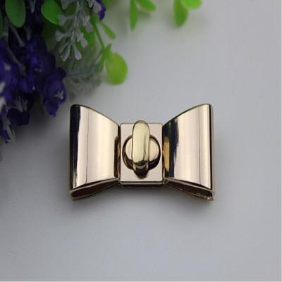 China Hanging plating zinc alloy fashion gold metal bow-knot pattern small purse turn locks for sale