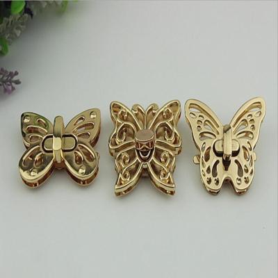 China Multi-size butterfly pattern gold zinc alloy fashion handbag twist turn locks for sale