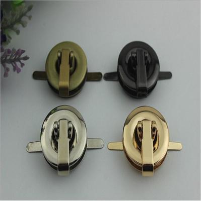 China Novelty zipper puller decorative round shape gunmetal color purse twist lock turn lock for sale