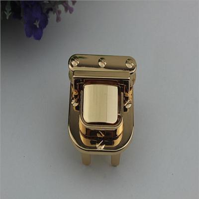 China Good plating hardware light gold zinc alloy bag push press locks for sale