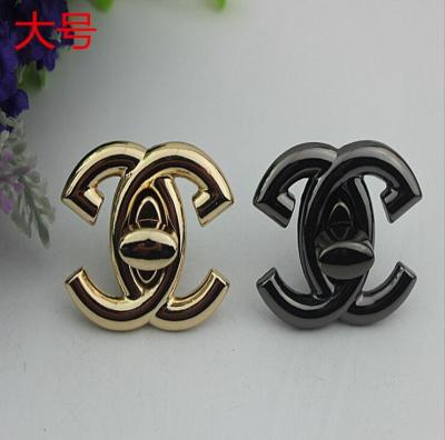 China Handbag Closure Accessories X Letters Gunmetal Color Twist Lock for sale
