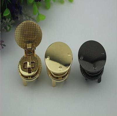 China Most popular novelty design round shape light gold bag hardware twist turn locks for leather for sale