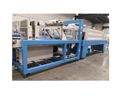 China Volledig automatische flessenverpakkingsmachine met aangepaste spanning en efficiëntie Te koop