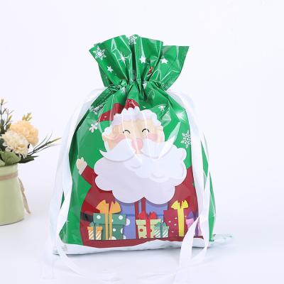 Cina Babbo Natale per bambini in plastica con coulisse, biscotto, caramelle, giocattoli, confezioni regalo in vendita