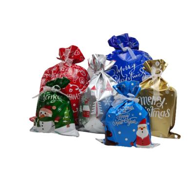 Cina Babbo Natale per bambini in plastica con coulisse, biscotto, caramelle, giocattoli, confezioni regalo in vendita