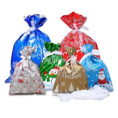 China De Giftzakken van de Folie van het Kerstmiskoord, de Giftzakken van het Vakantielint Te koop