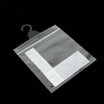 China Biodegradable Clear Garment Poly Packaging Bag With Hook for sale