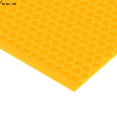China Grade A Natural Beeswax Foundation Sheet with 5.4mm Cell Size and Light Yellow Color for Beekeeping for sale
