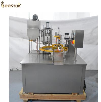 China Automatic Spoon Honey Packing Machine with Stainless Steel 304 PLC Control and 80gram/sec Speed for sale