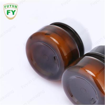 Cina Barattolo cosmetico all'ingrosso della crema di imballaggio per alimenti 30ml Amber Black Pet Plastic Cosmetic con il coperchio nero bianco in vendita