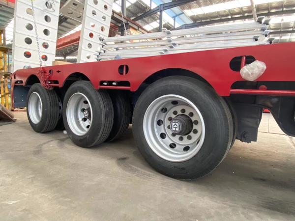 Quality 3 Axles Heavy Duty 60/80/100 Tons Lowbed Chassis Tractor Flated Bed Semi Trailer for sale