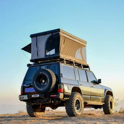 China Camping Aluminum 3 Person Outdoor Hiking Rooftop Roof Top Car Tent Triangle Clamshell Hard Shell Top Roof Tent for sale