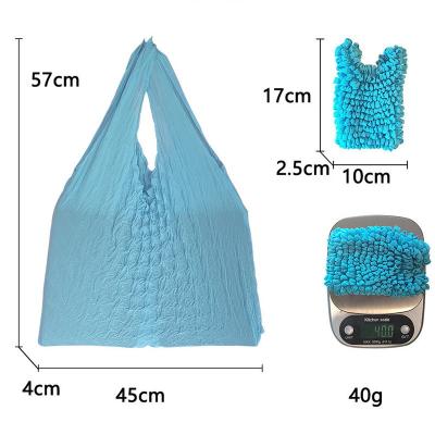 Cina Magic Expansion Fold Pleated Flexible Stretch Mini Bag Large Capacity Bubble Elastic Paddy Portable Shopping Handbag Tote in vendita