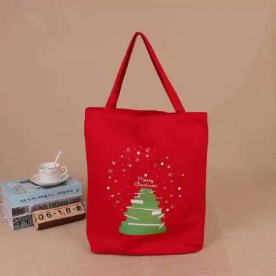 中国 2021子供のための熱い販売の昇進のカスタマイズされたクリスマスのキャンバスのトート バックの再使用可能なサンタの買い物袋のハンドバッグのギフト 販売のため