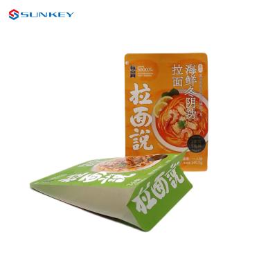 China Ziplockk Resealable Laminated Packaging Pouches Transparent Flat Bottom Standing Pouch for sale