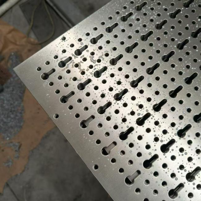Perforated metal plate with hexagonal hole pattern