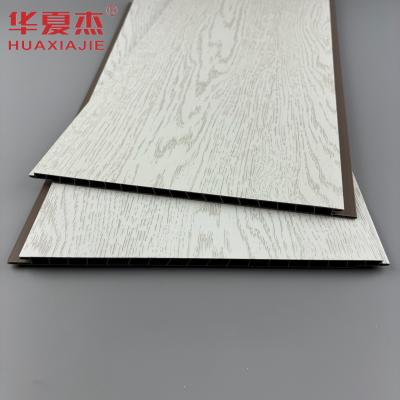 China Grãos de madeira brancos painéis de parede de PVC impermeáveis painéis de PVC decoração de edifícios à venda