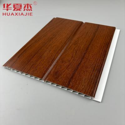 China Rrd Grão de madeira em forma de U painel de parede Pvc painel de teto Pvc para decoração de parede em casa à venda