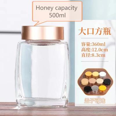 Cina 180 ml 500 ml 700 ml Bottiglia rotonda in vetro di miele a crema con forma rotonda e materiale di vetro in vendita