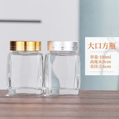 Cina 180 ml 500 ml 700 ml Bottiglia rotonda in vetro di miele a crema con forma rotonda e materiale di vetro in vendita