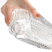 China Collar Material Glass 100ml Triangle Shape Vodka Bottle for Screen Printing for sale