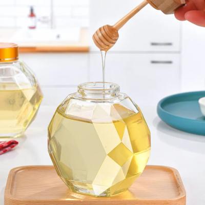 Cina 300 ml di vasetti di miele in vetro esagonale personalizzati con sigillo di sughero e con un becco di legno in vendita