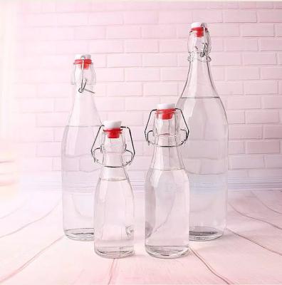 Cina Tipo di tenuta della bottiglia di vetro Cork 150ml 250ml 500ml 1000ml Forma rotonda Swing Top Wine Whiskey Bottles in vendita