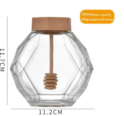 Cina 300 ml di vasetti di miele in vetro esagonale personalizzati con sigillo di sughero e con un becco di legno in vendita