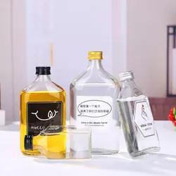 Cina 50 ml 100 ml 200 ml 250 ml 500 ml Bottiglia di vino piatta in vetro chiaro per succo di caffè da bere a freddo in vendita
