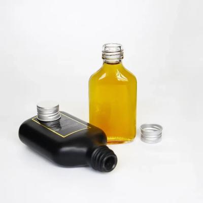 Cina Prodotti in vetro 100 ml bottiglia in vetro piatto trasparente su misura per whisky e liquori in vendita