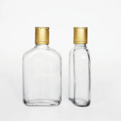 Cina Prodotti in vetro 100 ml bottiglia in vetro piatto trasparente su misura per whisky e liquori in vendita