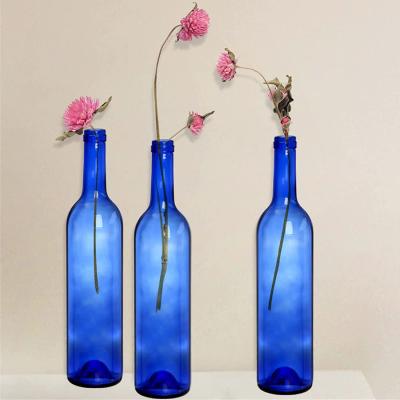 Cina Bottiglie di vetro da 750 ml per vodka champagne succhi di frutta bevande decorazioni azzurro cobalto rotondo in vendita