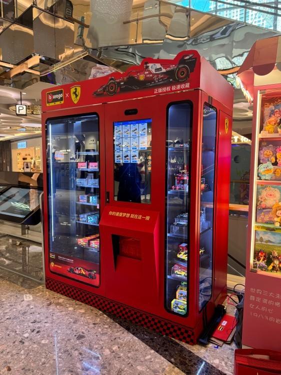 Customer using the model car vending machine