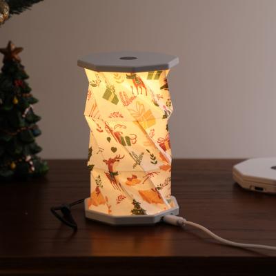 China Portable Paper Spinning Lamp Night Light Christmas Clip On Folding Lantern for sale