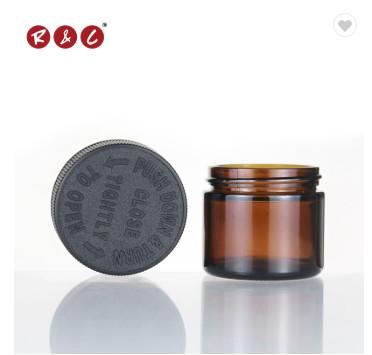 China 60ML Amber Childproof Glass Jar With Child Resistant Lid For CBD Weeds for sale