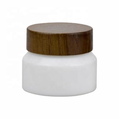 China 2020 new product factory china OEM personalized porcelain white 50g cosmetic glass jars with bamboo lid for sale
