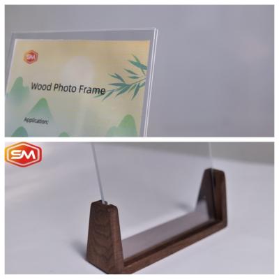 China Quadros fotográficos transparentes de plástico Perspex Quadro fotográfico acrílico com base de madeira for sale