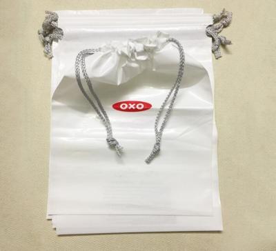 China Biodegradable Environment Friendly Hotel Packaging Clothes For Laundry Plastic Bag Customized Poly Plastic Drawstring Cu for sale