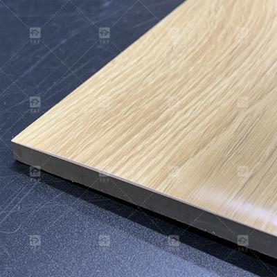 Cina Alto lucido interno legno look porcellana pavimento piastrelle antiscivolo lucidato vetrata porcellana piastrelle salotto per pavimenti in vendita