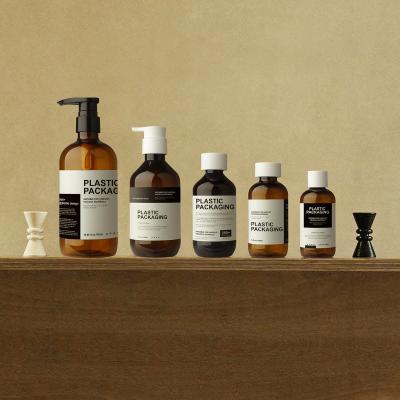 China Amber Plastic Shampoo Bottle 500ml with Pump Spray for Conditioner and Shower Gel for sale