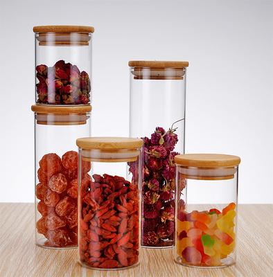 ODM / OEM personalizzato elegante casa giara di vetro rotondo 8oz 26oz cibo giara di vetro con coperchio di bambù ermetico design elegante e pratico