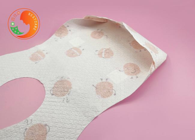 Disposable bib showing colorful cartoon pattern