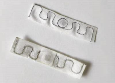 China 8 Heat Sealing Durable UHF Laundry Tag Single Layer With M4E Chip , heat seal adhesive laundry tag for sale