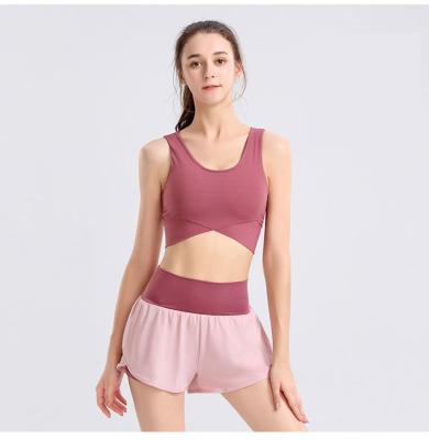 Cina Il reggiseno degli sport delle donne posteriori sexy di misura stretta su ordine e mette l'insieme in cortocircuito in vendita