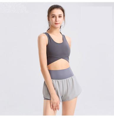 Cina Il reggiseno degli sport delle donne posteriori sexy di misura stretta su ordine e mette l'insieme in cortocircuito in vendita