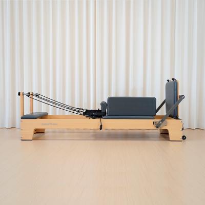 China Commercial Studio Beech Wood Pro Pilates Reformer Bed Fitness Center for sale